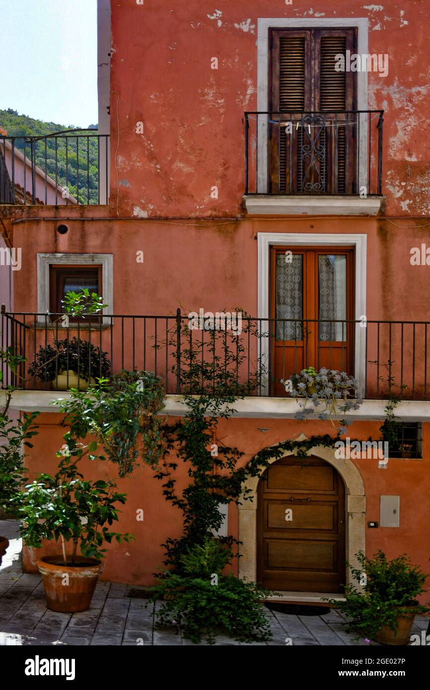 The facade of an old house in the historic center of Maratea, a ...