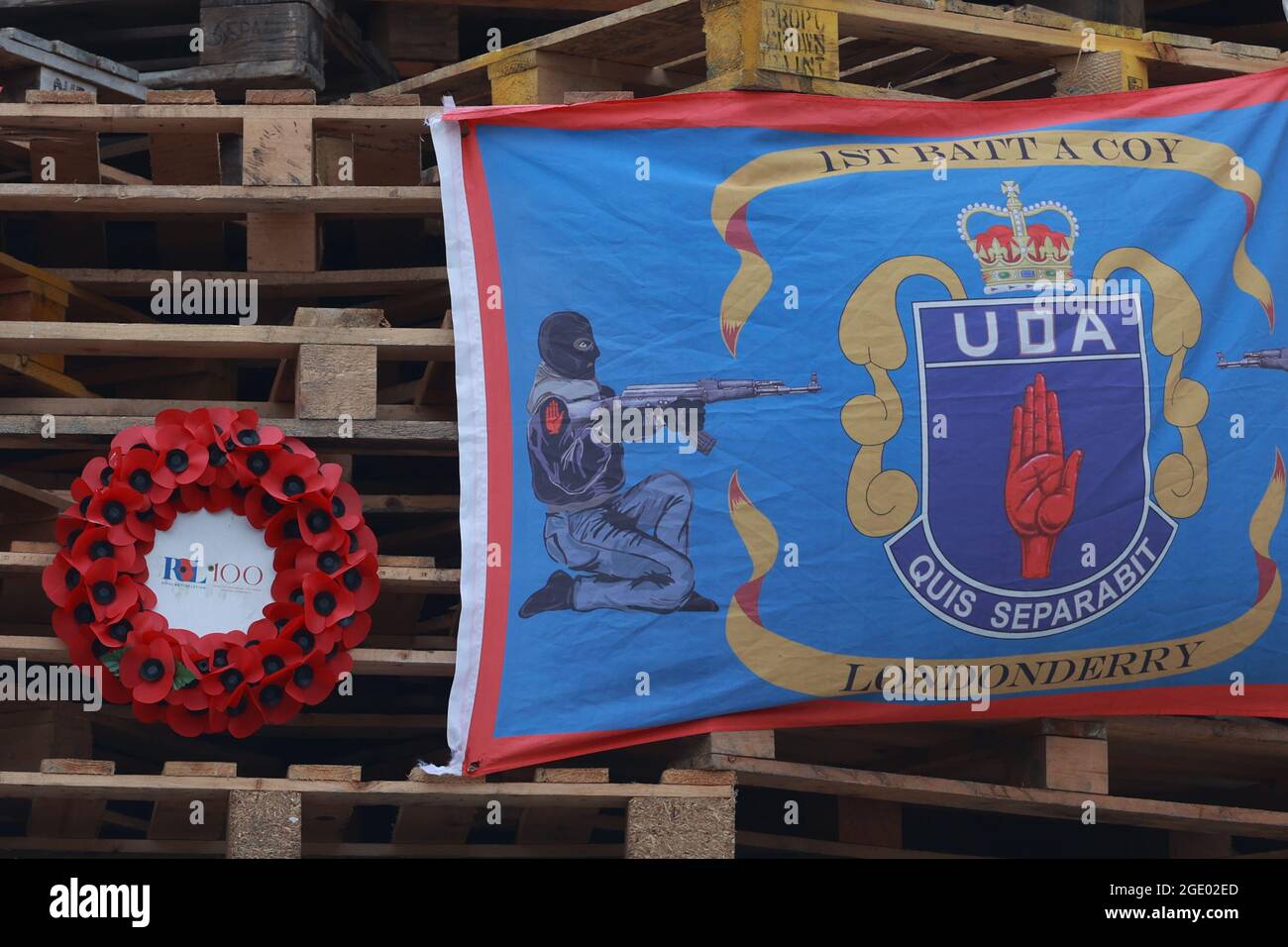 Royal British Legion poppy wreath next to a loyalist paramilitary UDA ...