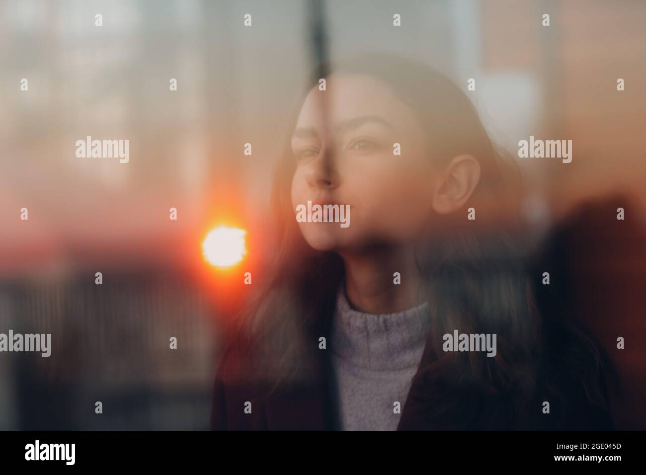 Beautiful young teenager girl portrait behind window glass Stock Photo ...