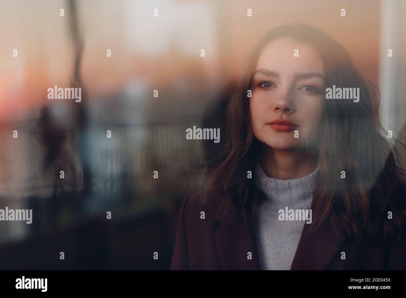 Beautiful young teenager girl portrait behind window glass Stock Photo ...