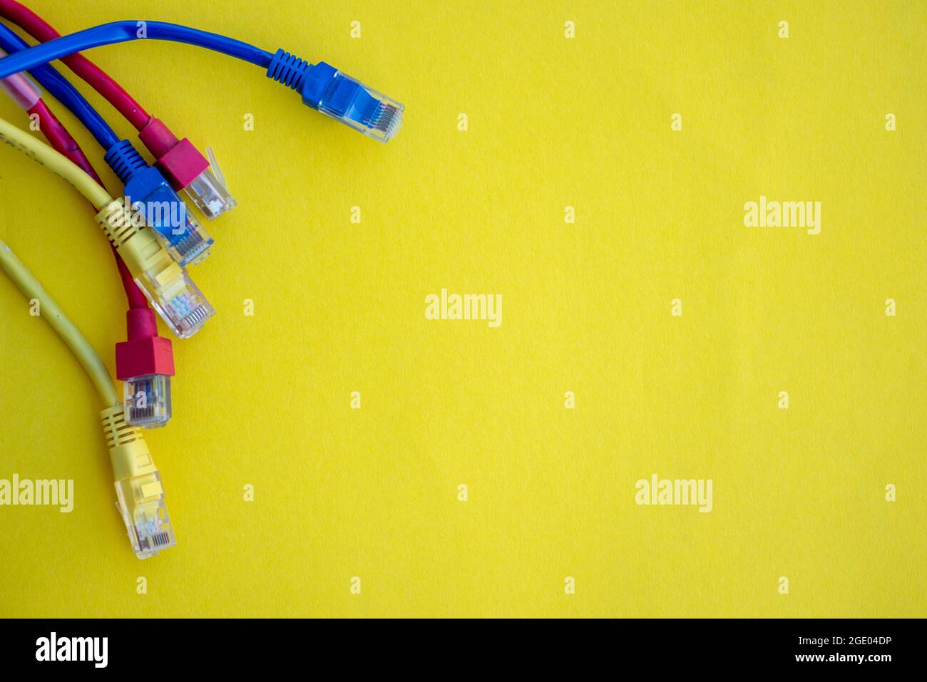 Ethernet cables isolated against yellow background Stock Photo - Alamy