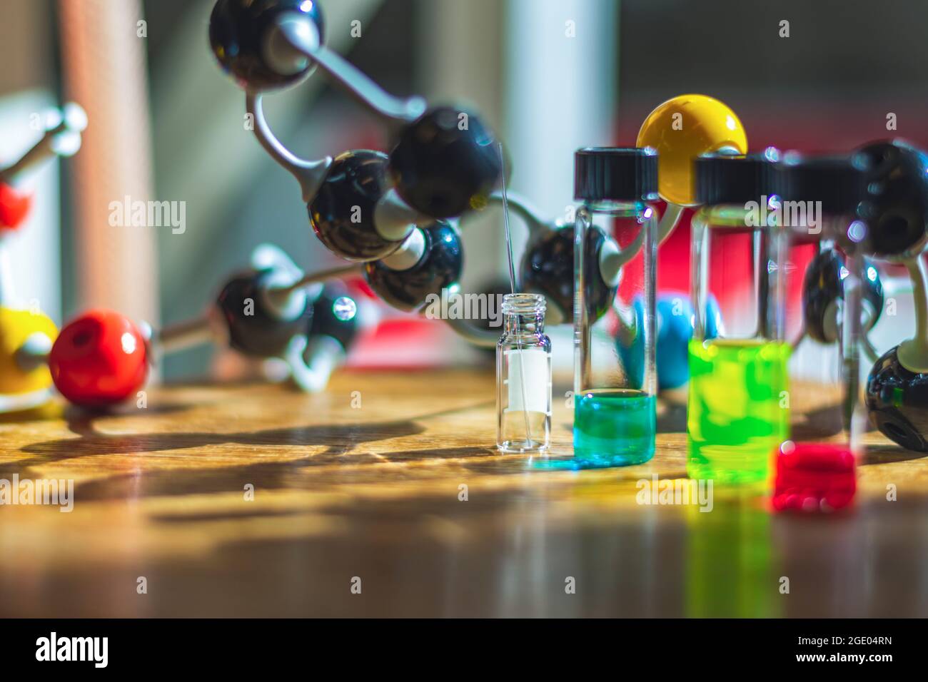 Chemical compound solutions in different glass vials under the light ...