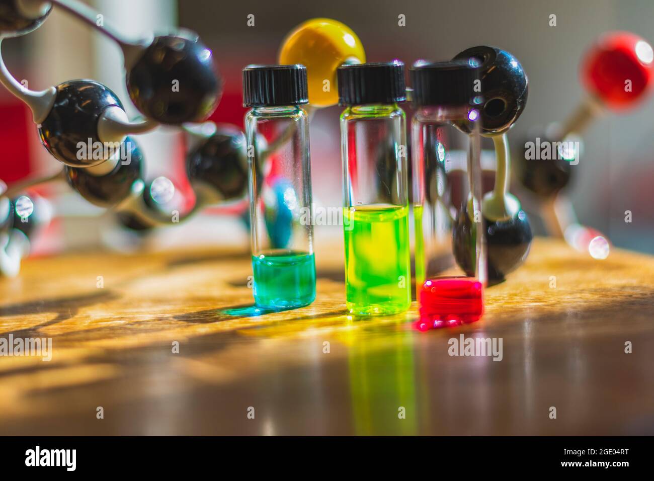 Chemical compound solutions in different vials under the light with ...