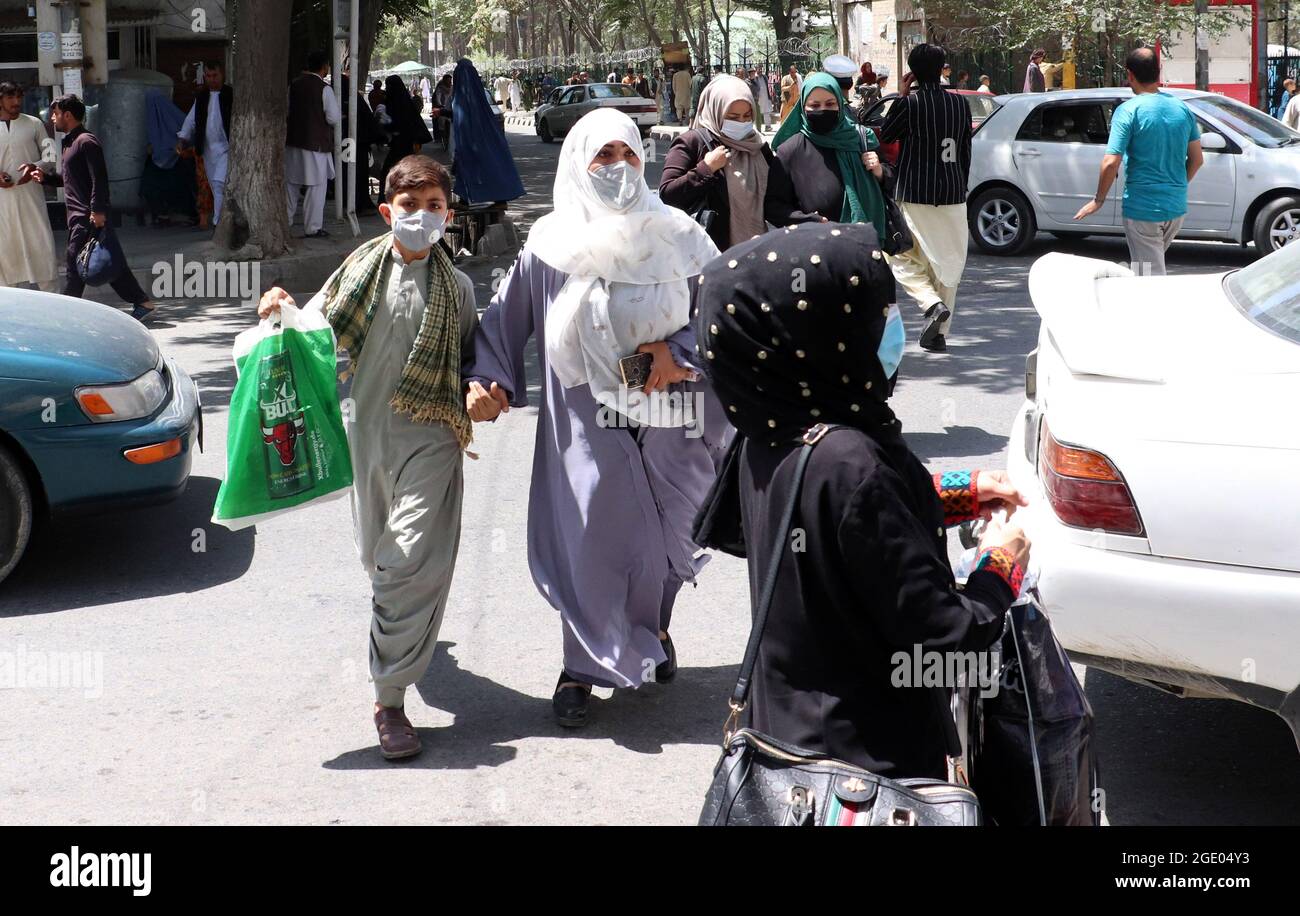 Kabul, Afghanistan. 15th Aug, 2021. People rush to their homes after ...