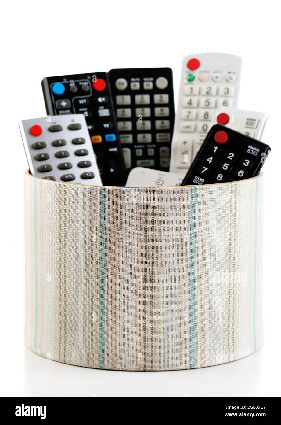 Many remote control devices in container isolated on white Stock Photo ...