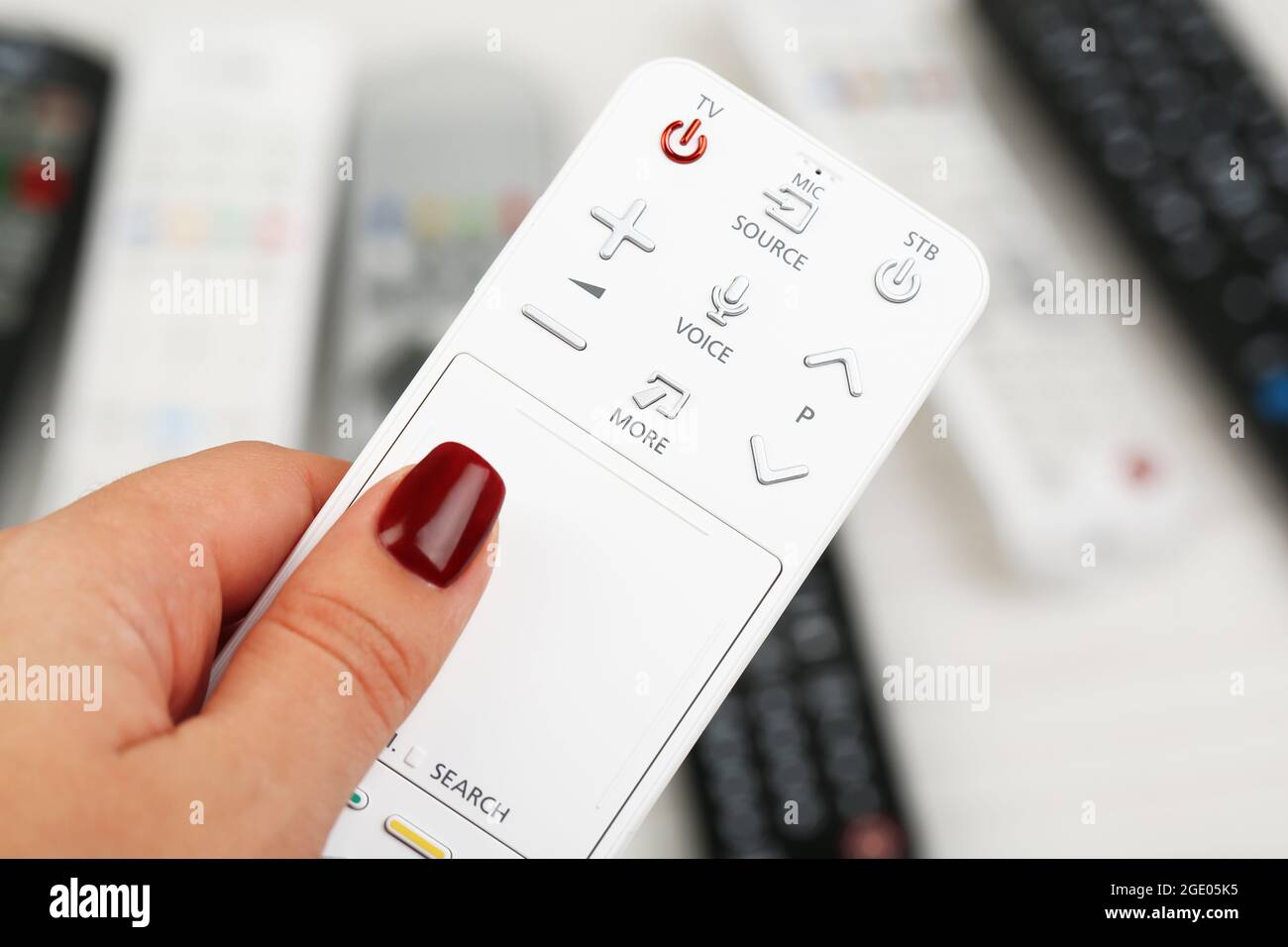 Remote control device in hand Stock Photo - Alamy
