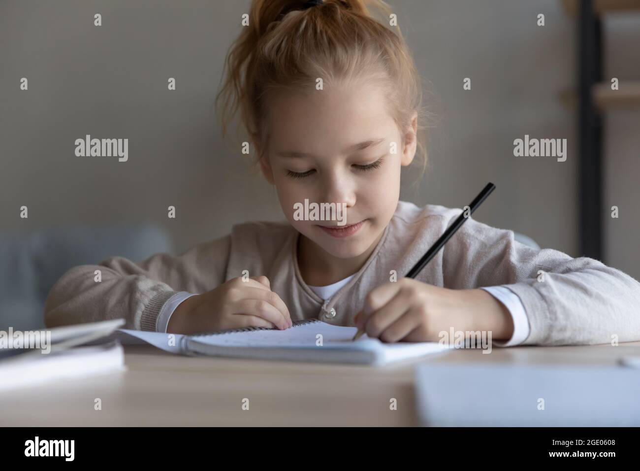 Smart small girl child study at home Stock Photo - Alamy