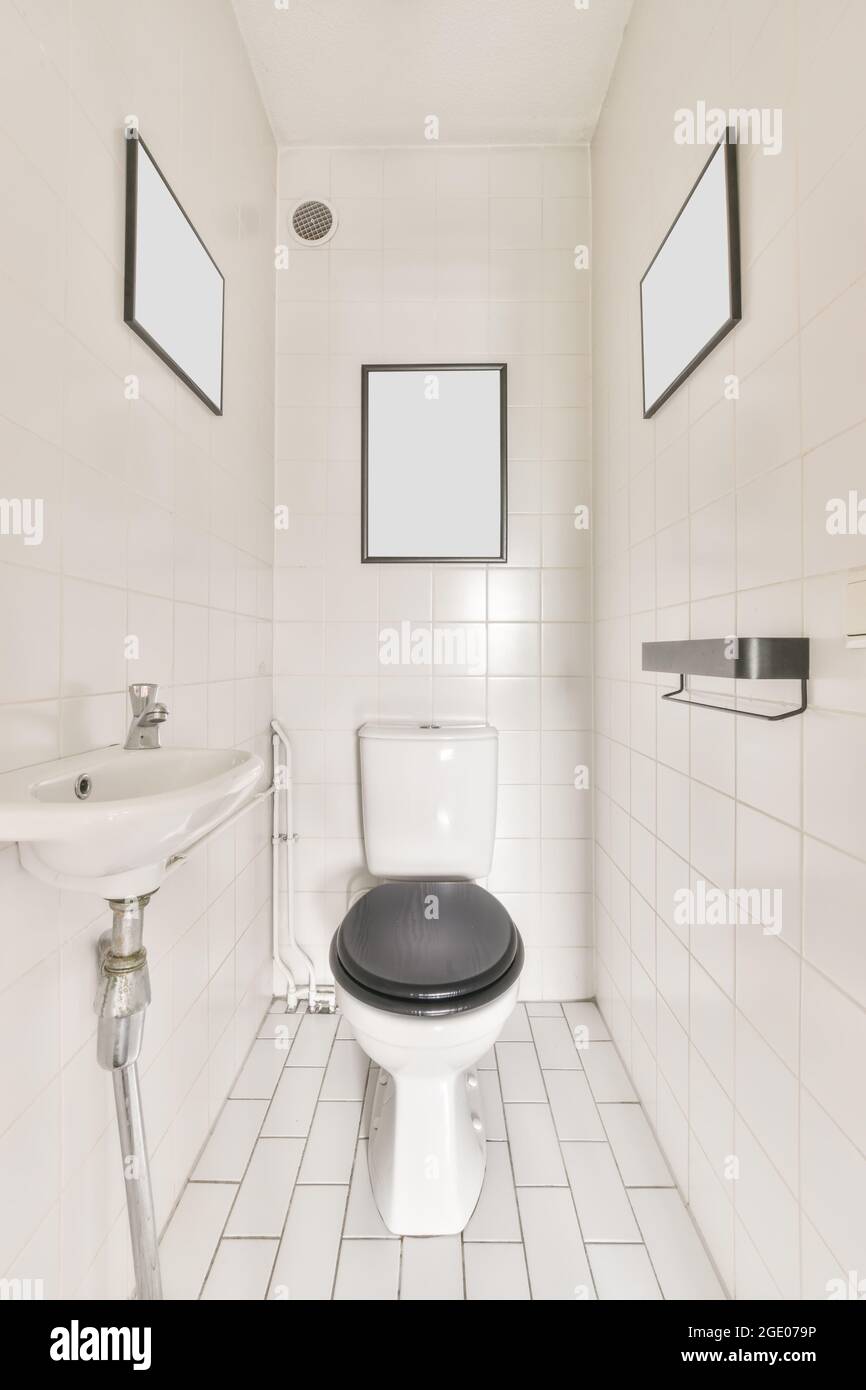 Interior of small clean washroom in miniature style Stock Photo - Alamy