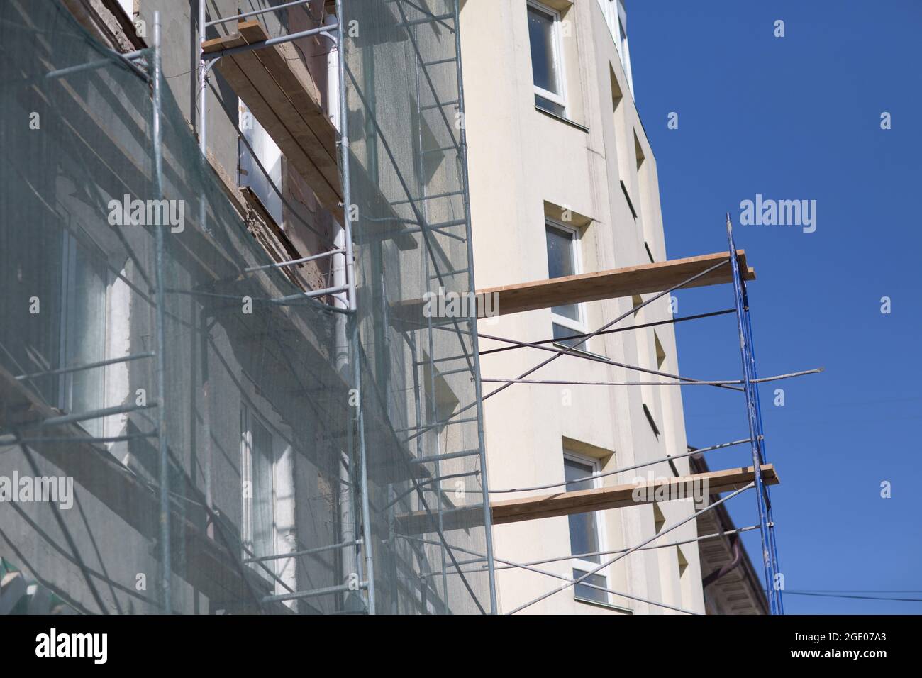 Scaffolding on building house in the city Stock Photo - Alamy