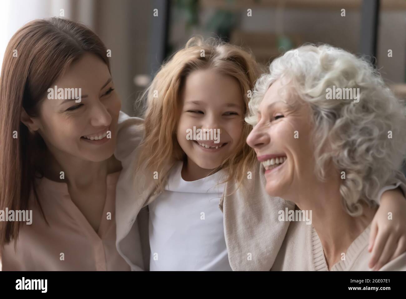 Happy three generations of women play together at home Stock Photo - Alamy