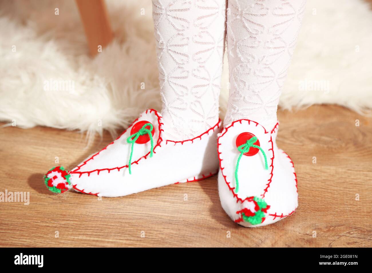 Female feet in decorative Christmas shoes Stock Photo - Alamy