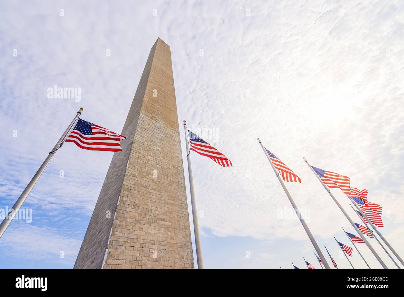 The giant Washington Monument with flags Stock Photo - Alamy