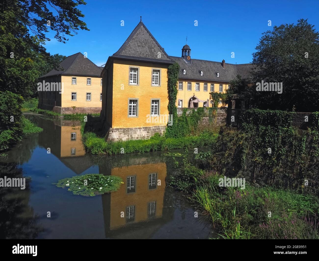 Romantic yellow water castle Schloss Dyck in Juechen in Germany Stock ...