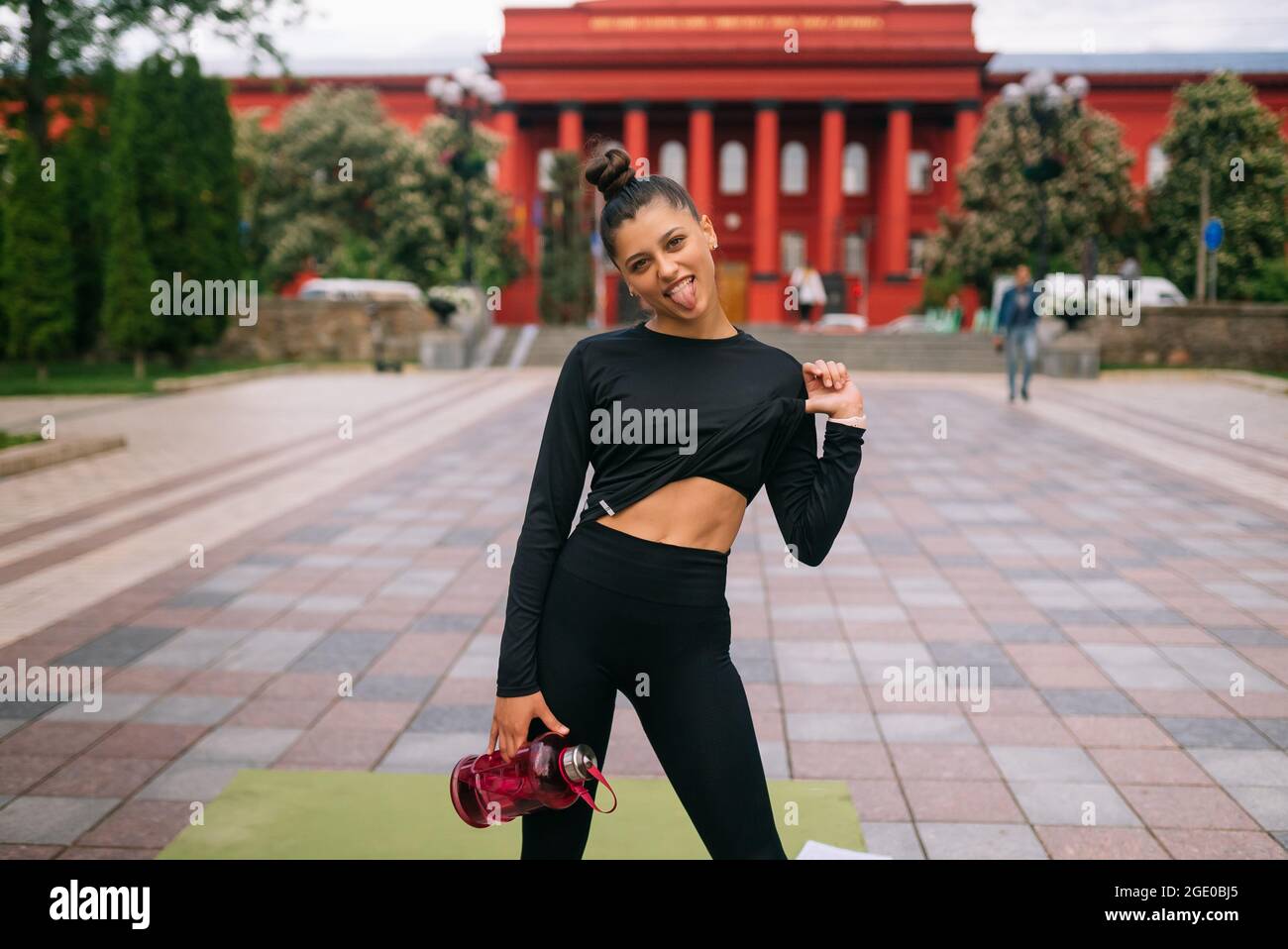 Fitness model in sportswear posing on the city street Stock Photo - Alamy