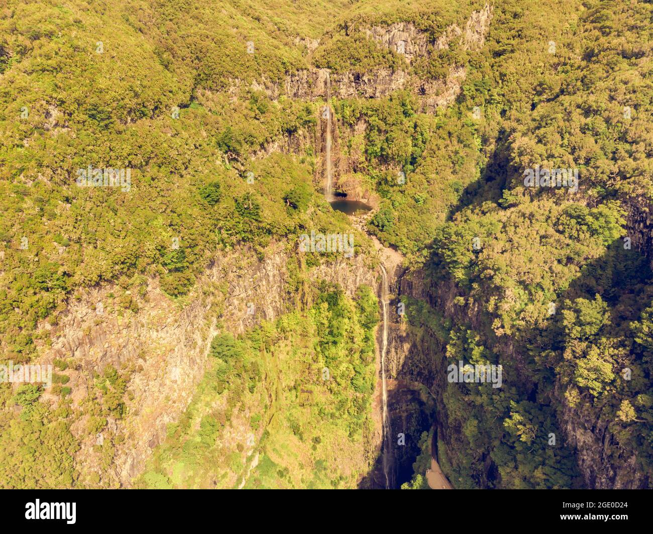 Aerial view of double waterfall surrounded with volcanic walls and ...