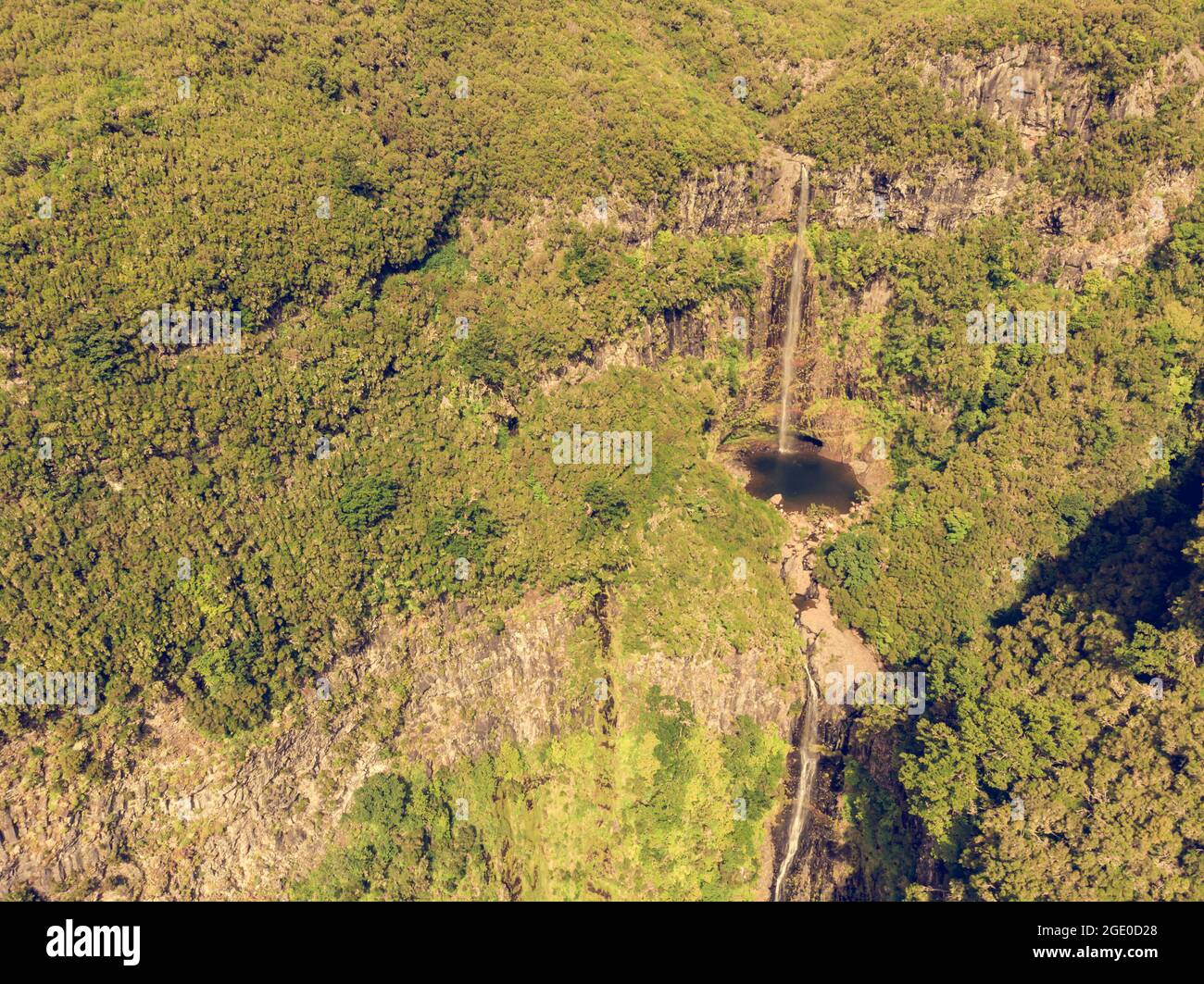 Aerial view of double waterfall surrounded with volcanic walls and ...