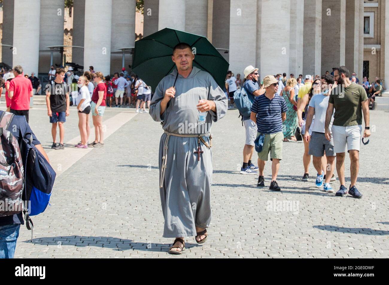 Monk looking Pope Francis waves from the window of the apostolic palace ...