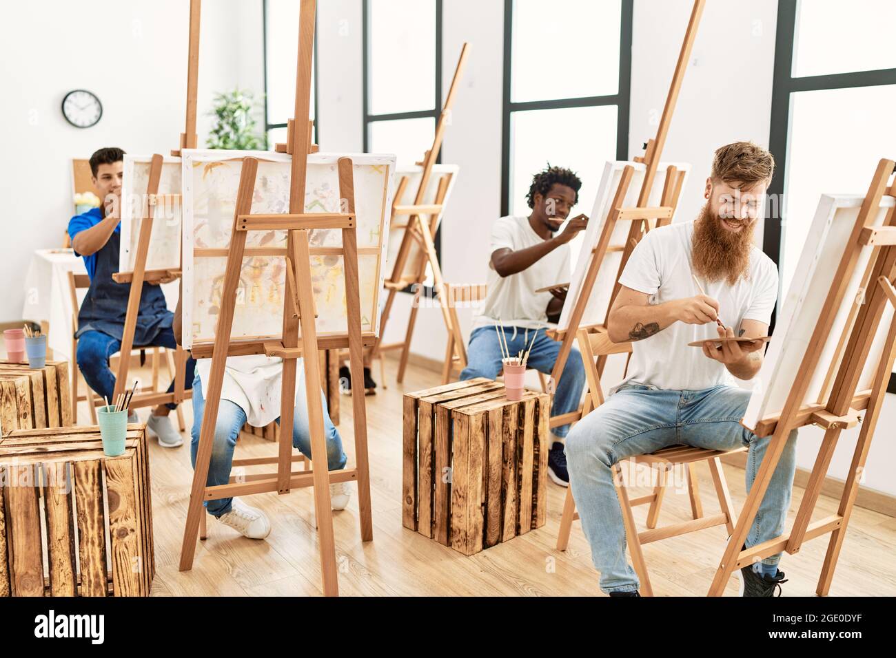 Group of people smiling happy drawing at art studio Stock Photo - Alamy