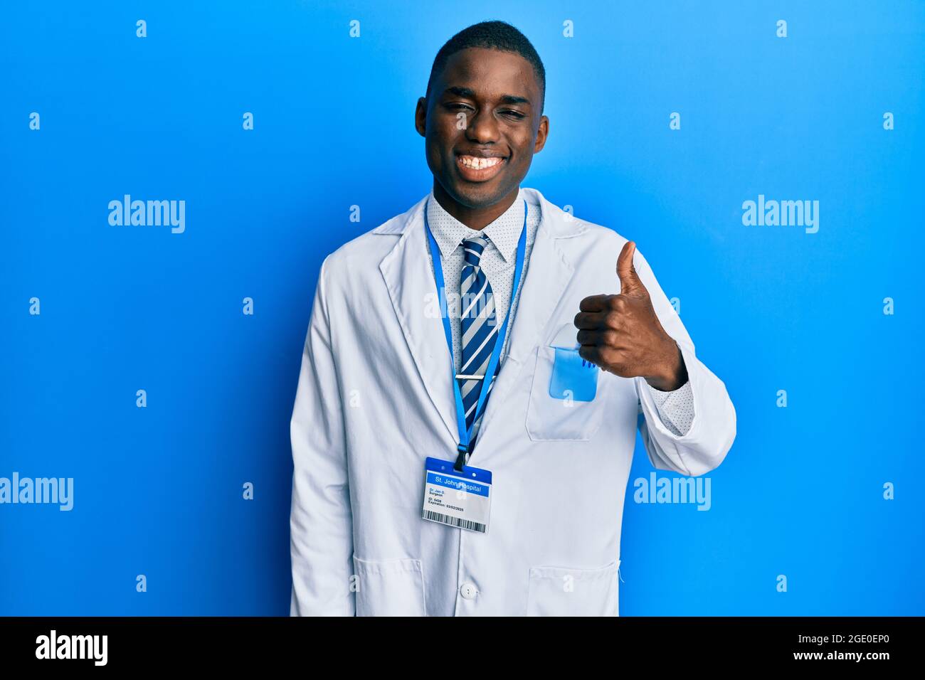 Young african american man wearing scientist uniform smiling happy and ...