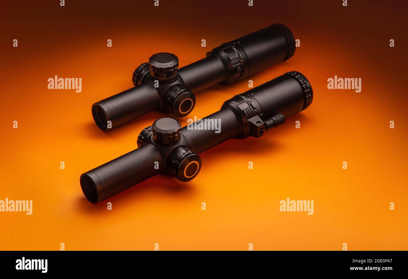 Modern sniper scopes on a colored background. Optical device for long ...