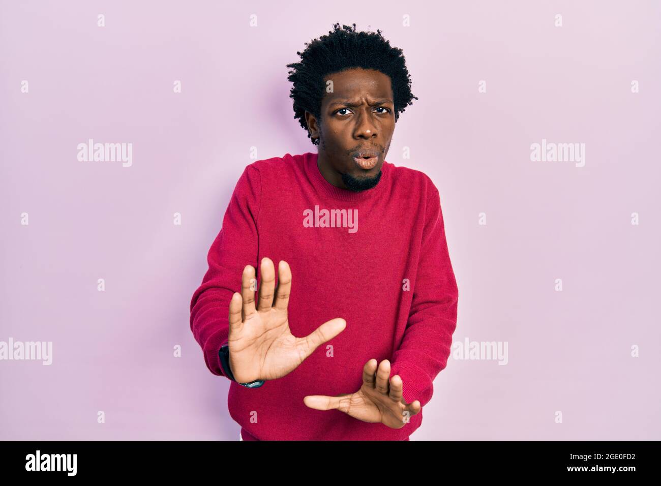 Young african american man wearing casual clothes moving away hands ...
