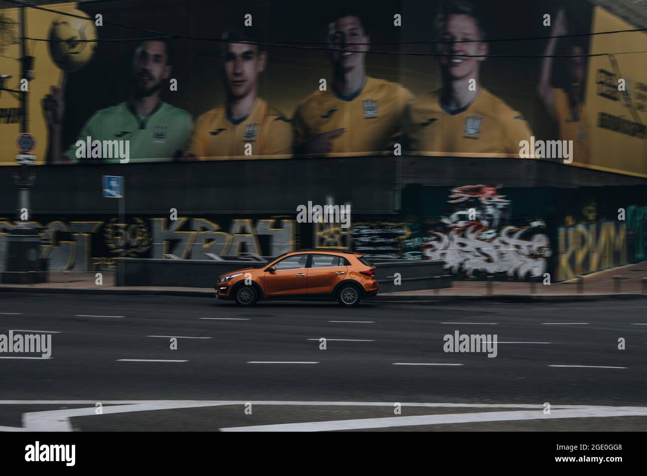 Ukraine, Kyiv - 2 June 2021: Orange KIA Rio car moving on the street ...