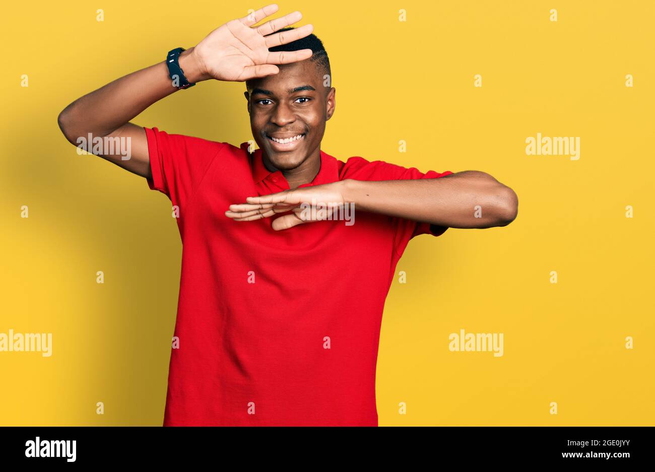 Young african american man wearing casual red t shirt smiling cheerful ...