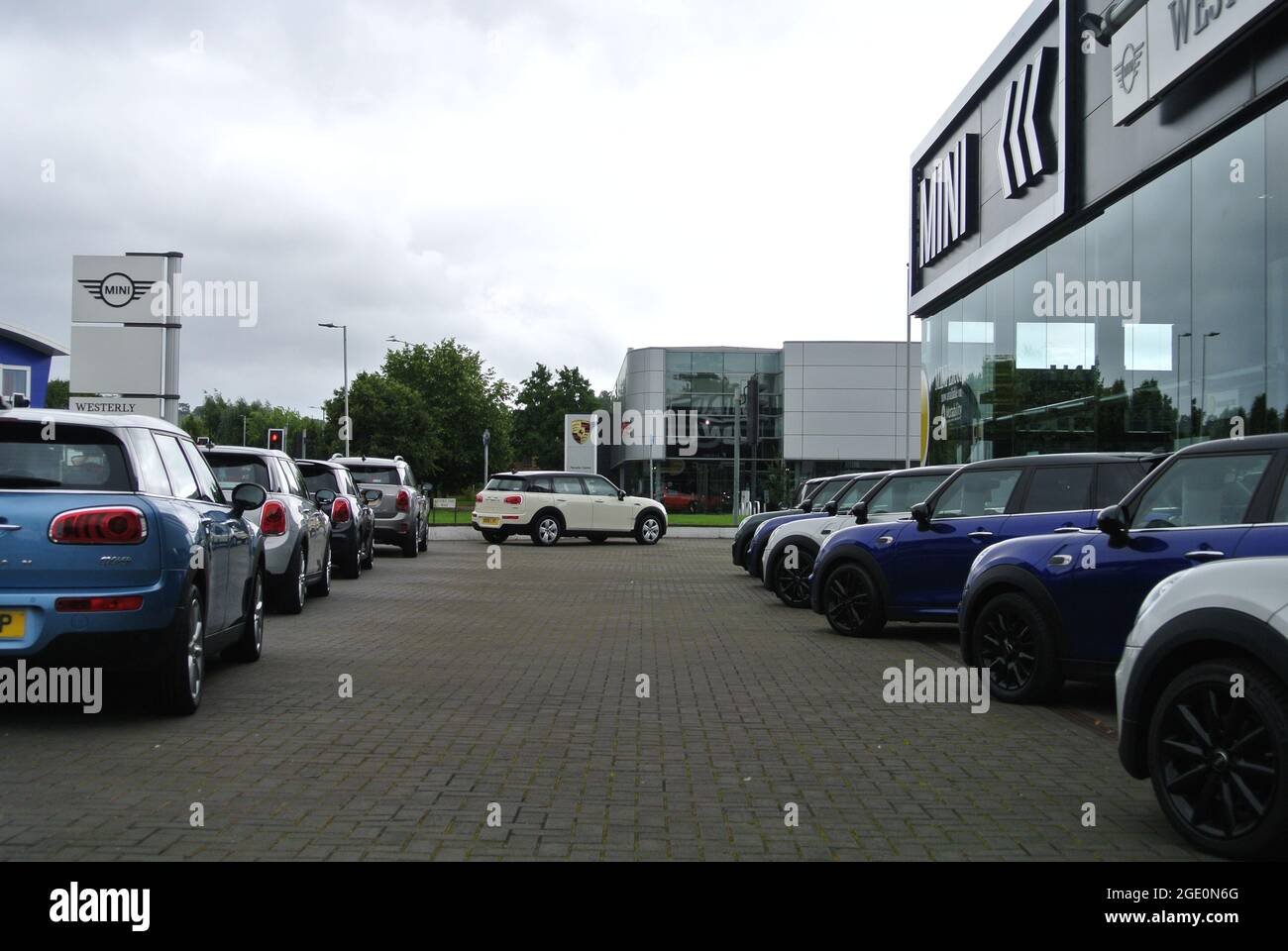 Exterior shot of brand new Mini One cars for sale at a car dealership ...