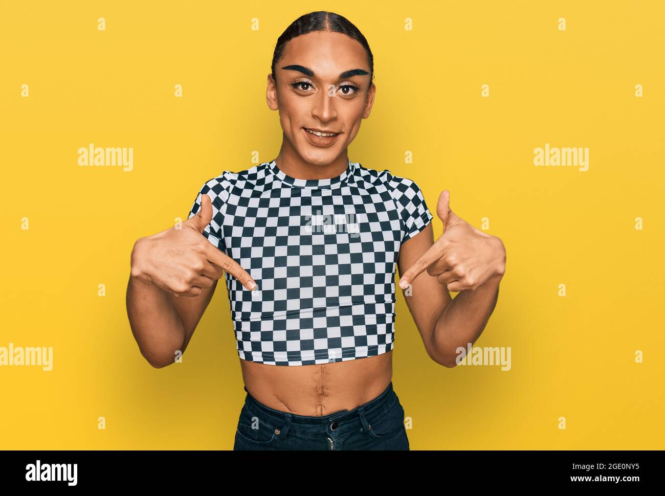 Hispanic transgender man wearing make up and long hair wearing modern ...
