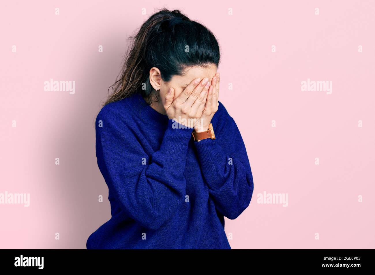 Young hispanic woman wearing casual clothes with sad expression ...