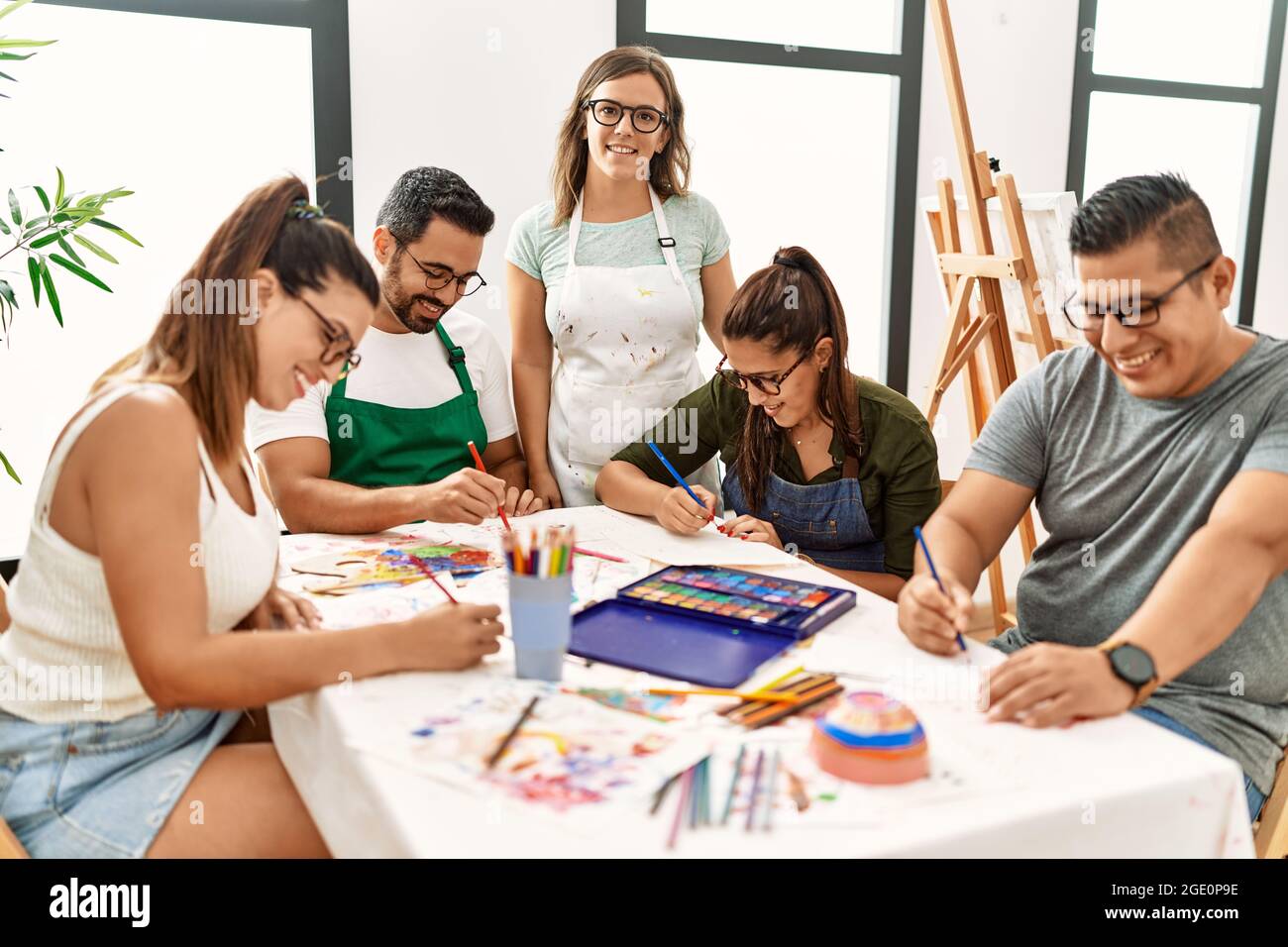 Group of draw students sitting on the table drawing at art studio Stock ...