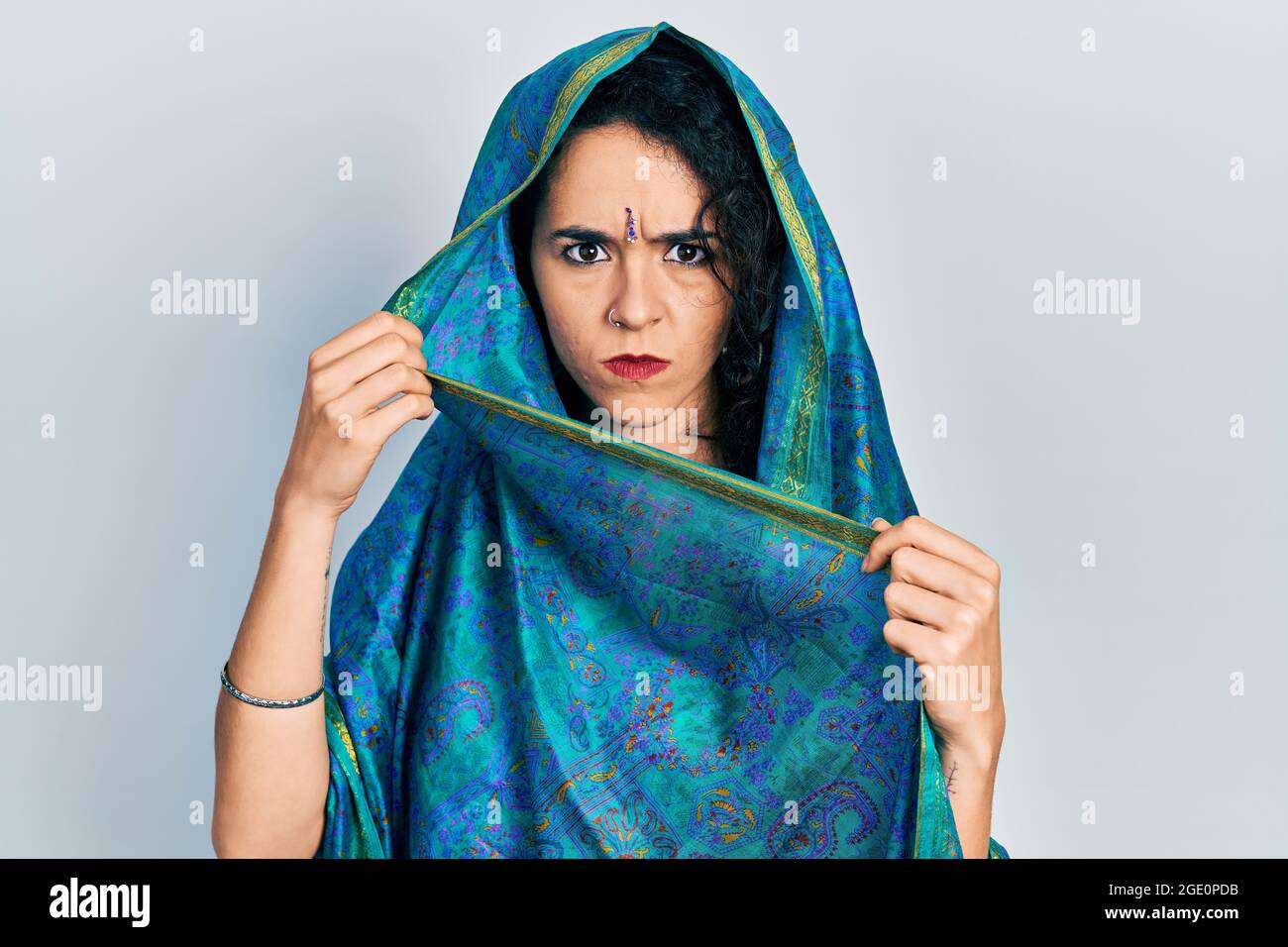 Young woman wearing bindi wearing traditional indian saree feeling ...