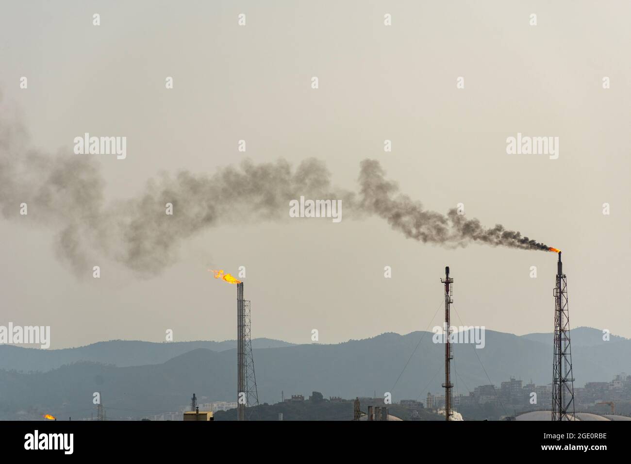 Fire from a gas torch in a large oil industry refinery factory in the ...