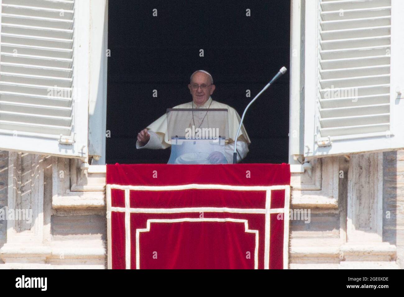 Pope Francis waves from the window of the apostolic palace overlooking ...