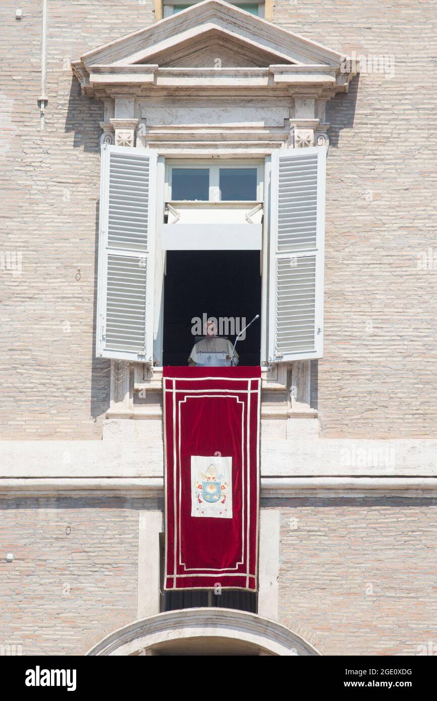 Pope Francis waves from the window of the apostolic palace overlooking ...