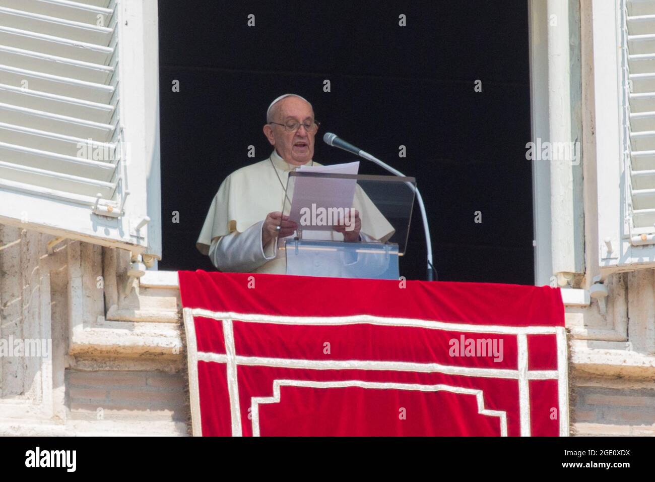 Pope Francis waves from the window of the apostolic palace overlooking ...