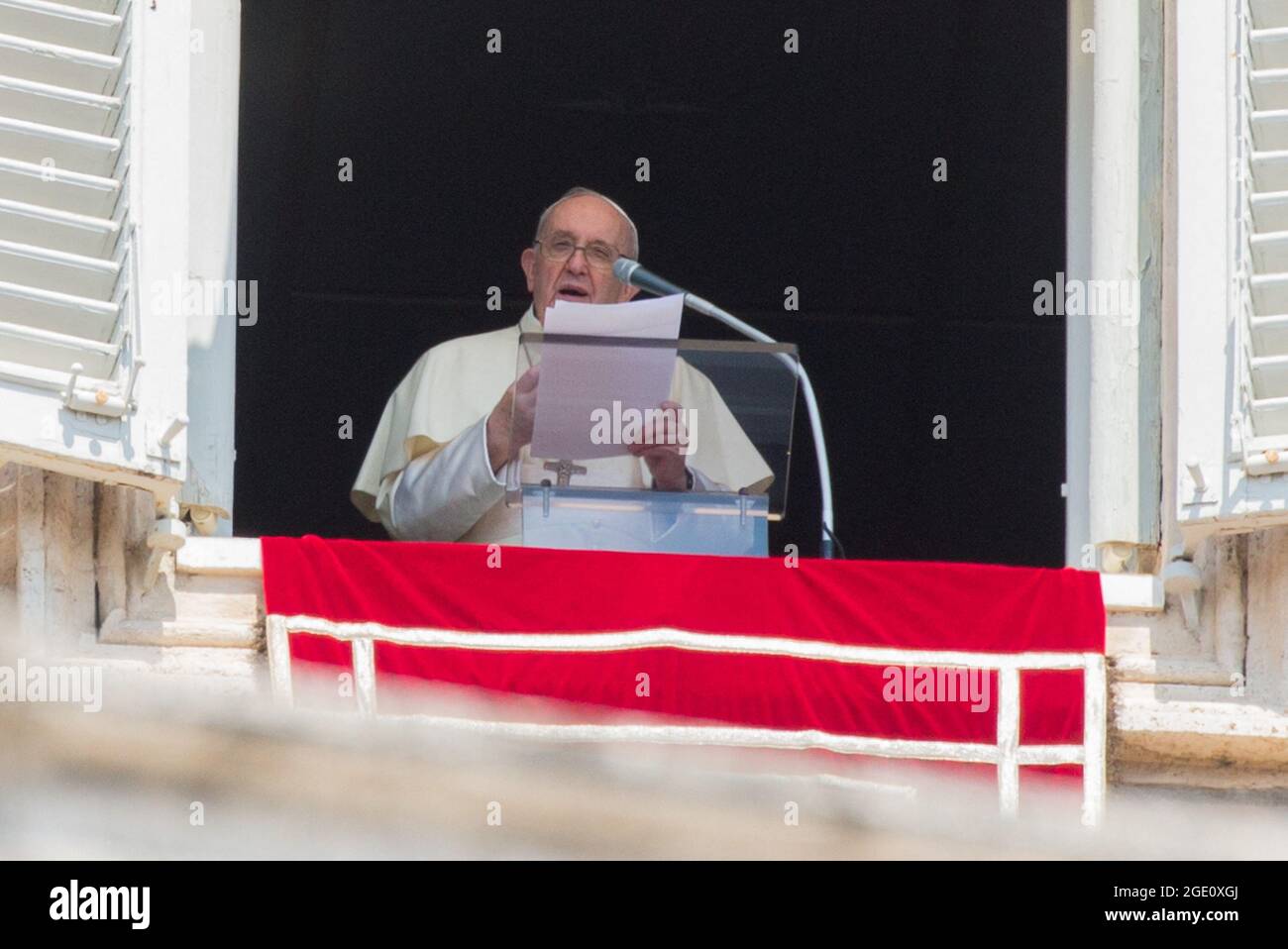 Pope Francis waves from the window of the apostolic palace overlooking ...