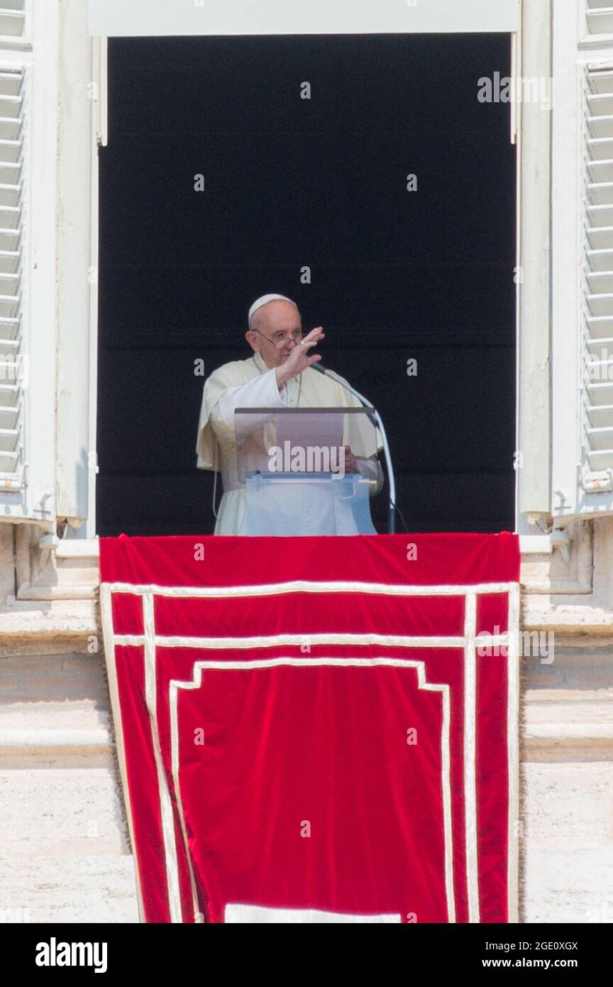 Pope Francis waves from the window of the apostolic palace overlooking ...