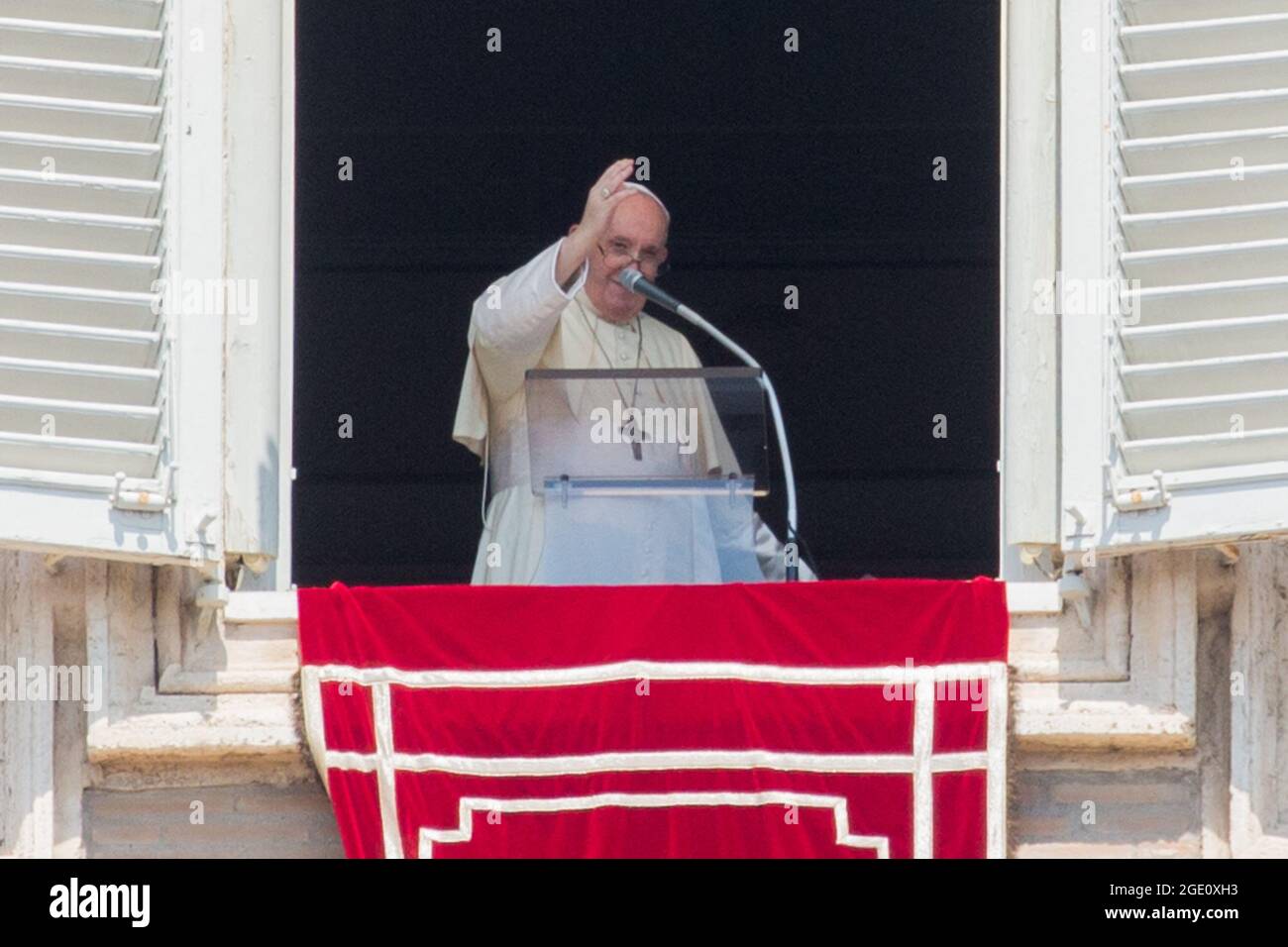 Pope Francis waves from the window of the apostolic palace overlooking ...