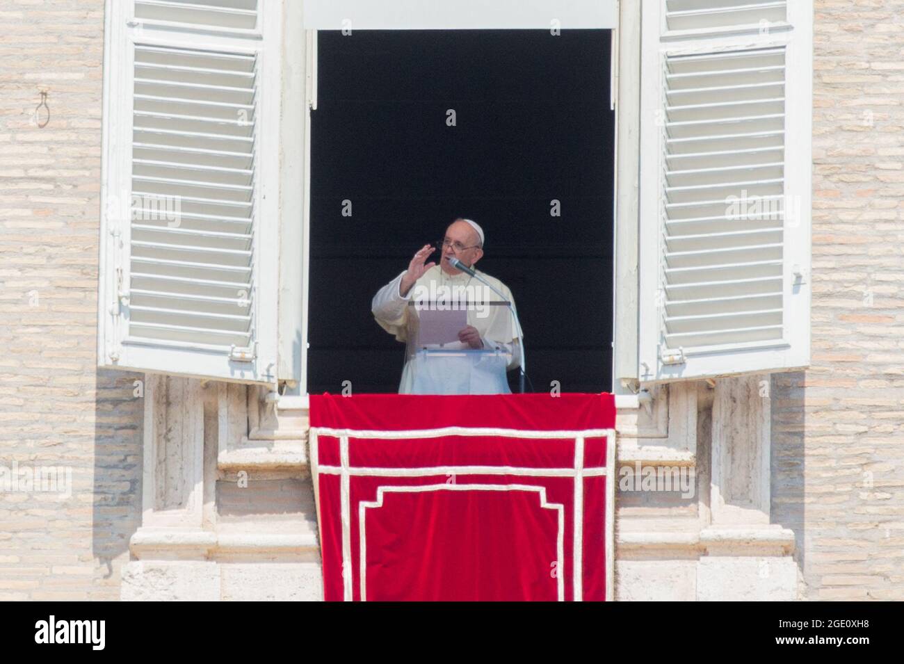 Pope Francis waves from the window of the apostolic palace overlooking ...