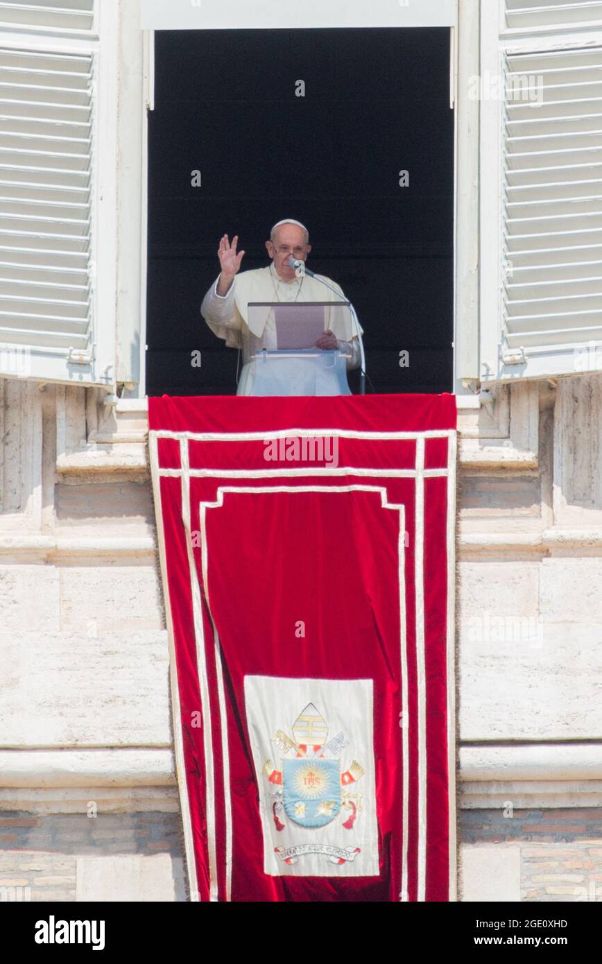 Pope Francis waves from the window of the apostolic palace overlooking ...