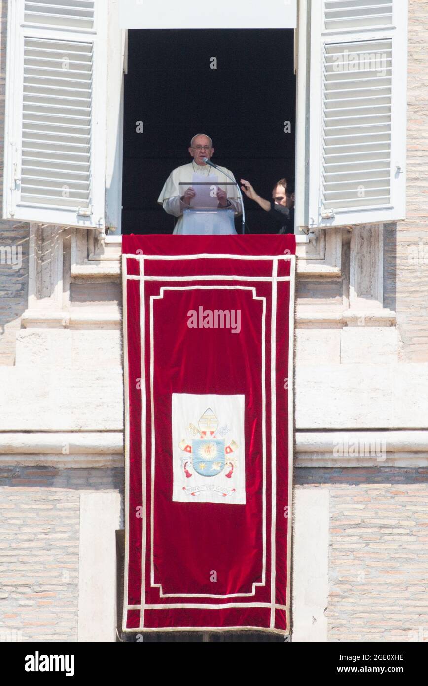 Pope Francis waves from the window of the apostolic palace overlooking ...