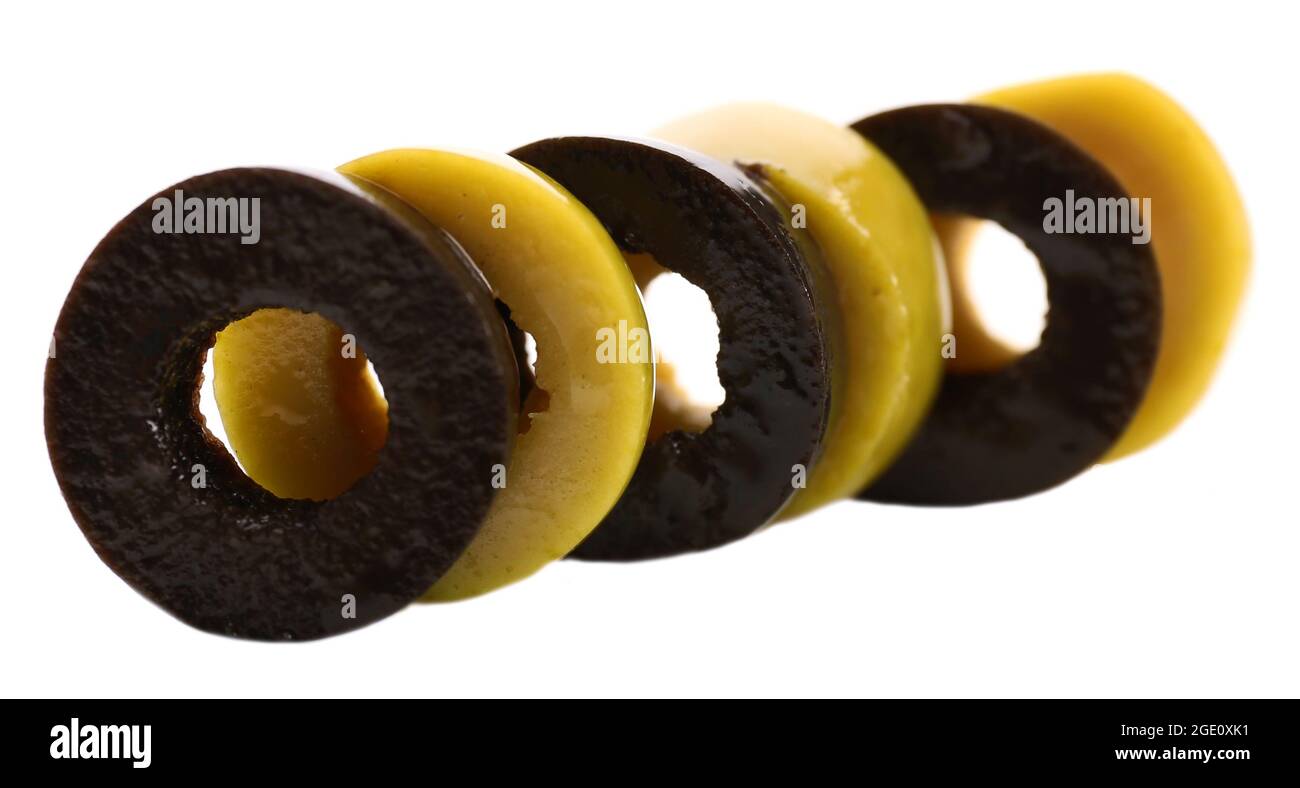 Green and black cut olive rings isolated on white Stock Photo - Alamy
