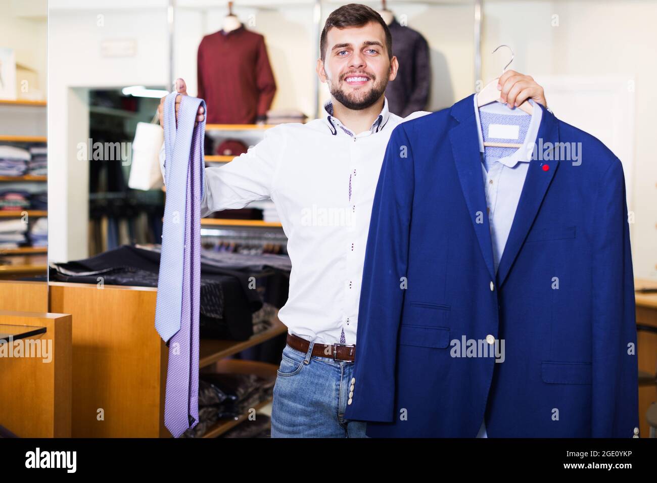 owner guy displaying jacket Stock Photo - Alamy