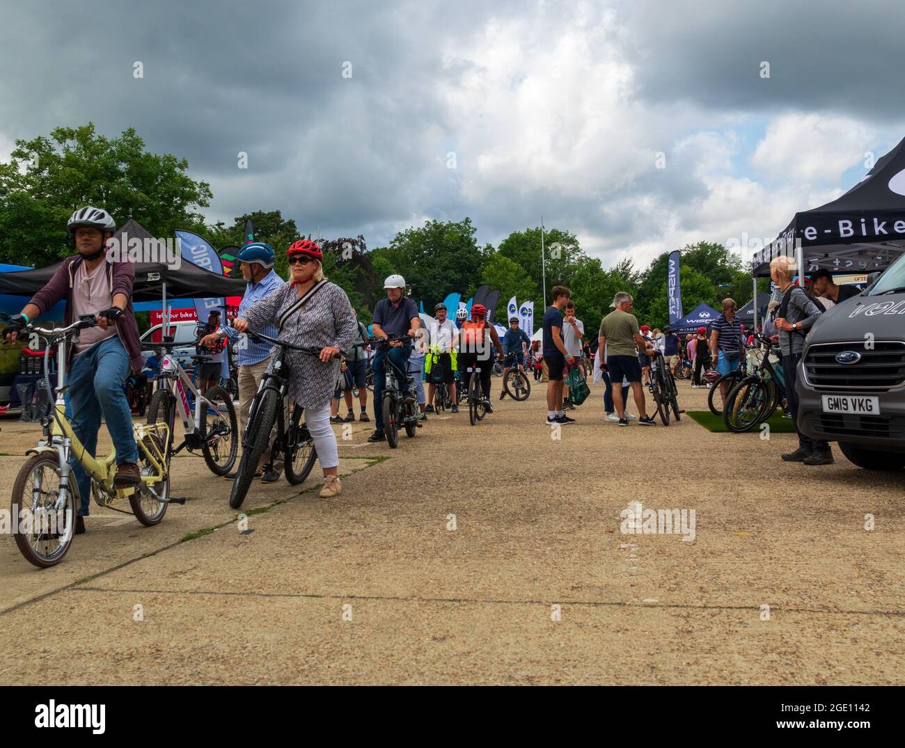 A diverse crowd cycling ebikes on the demo track at The Cycle Show E ...