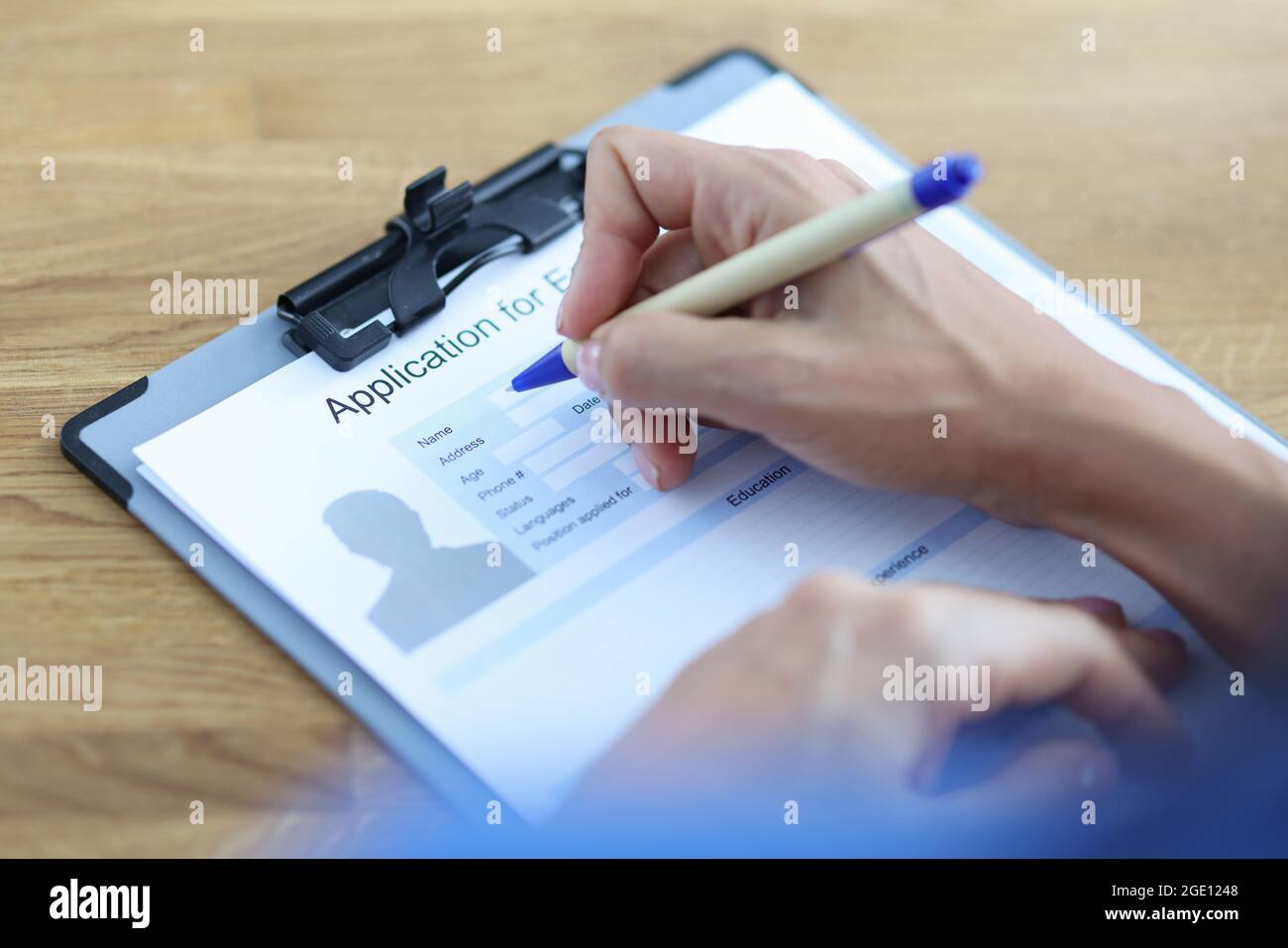 Woman filling out documents for employment with ballpoint pen closeup ...