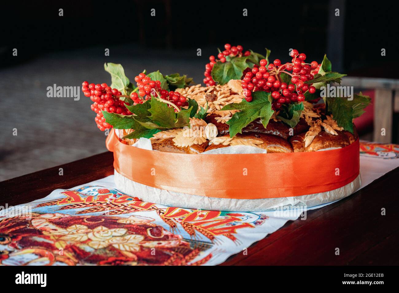 Traditional wedding loaf decorated with bunches of red viburnum Stock ...