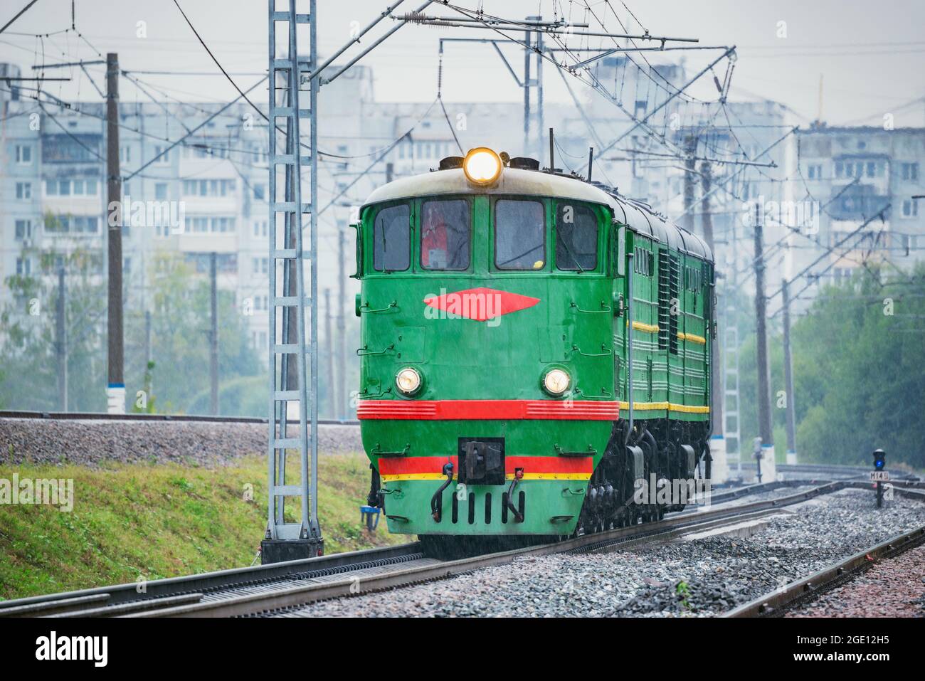 Freight retro diesel locomotive under the pouring rain Stock Photo - Alamy