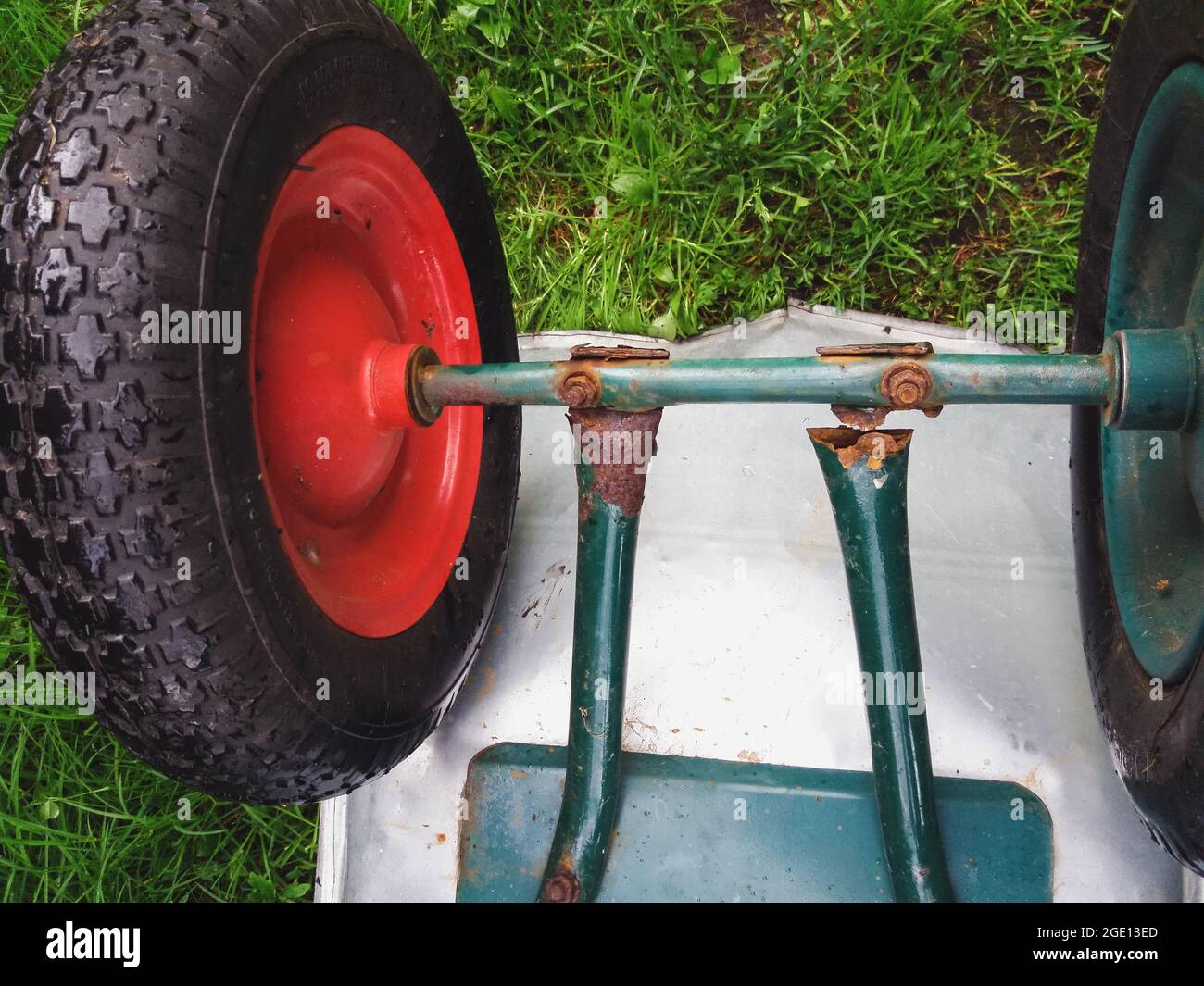 Broken rusty wheelbarrow damaged by metal corrosion Stock Photo - Alamy