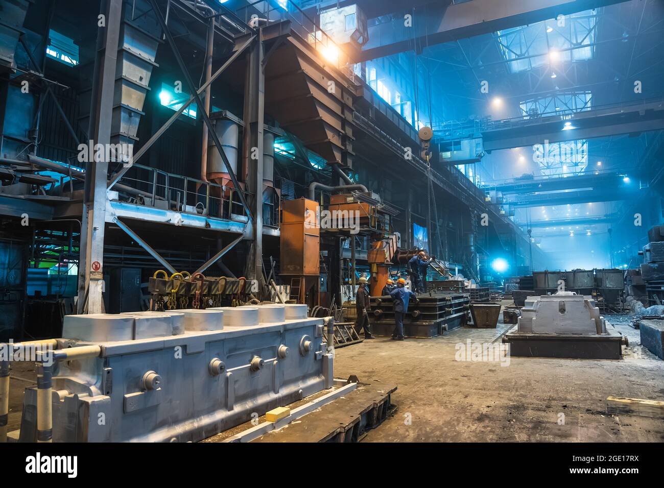 Interior of steel mill. Workers in workshop of metallurgical plant ...